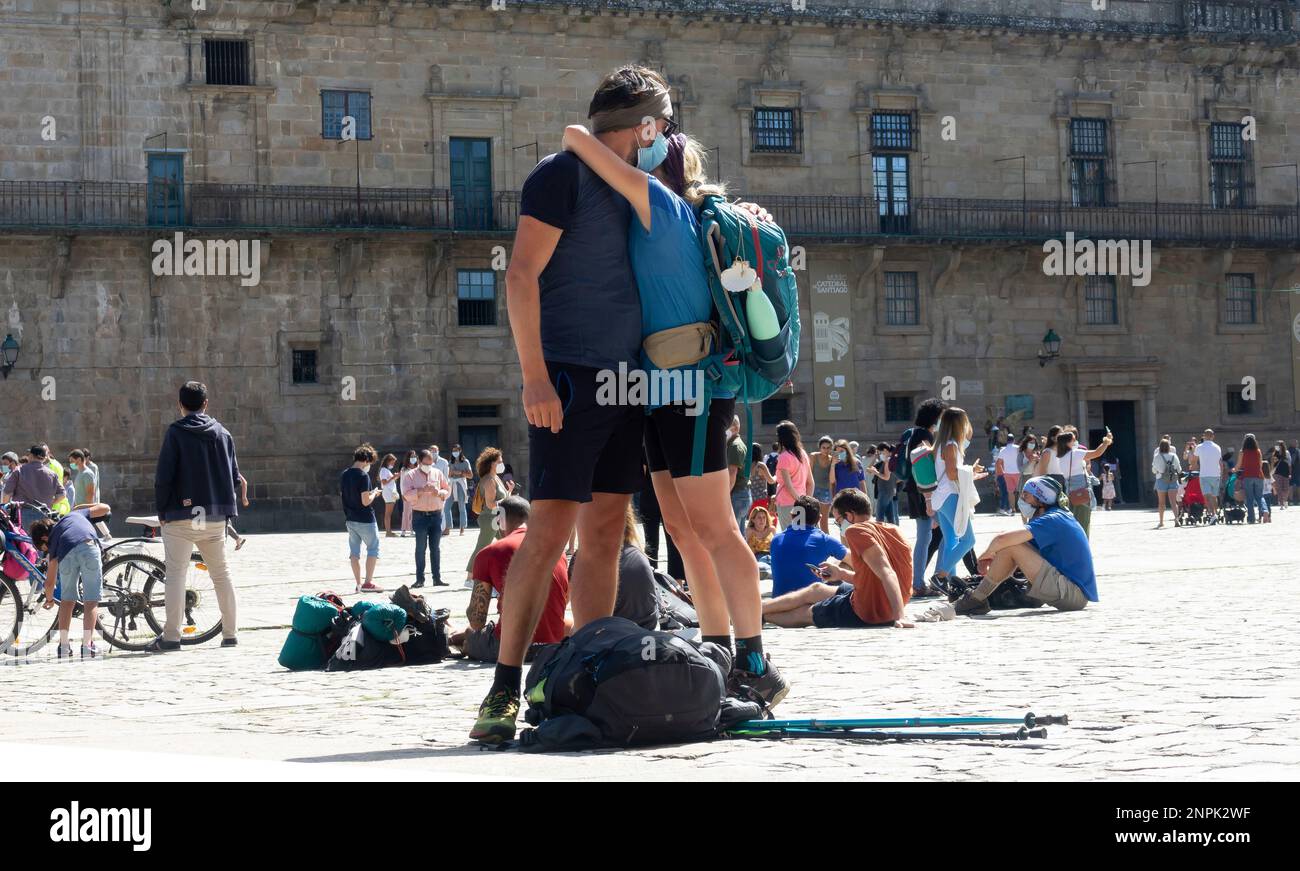 A couple of Italian pilgrims kiss each other when they arrive at the ...
