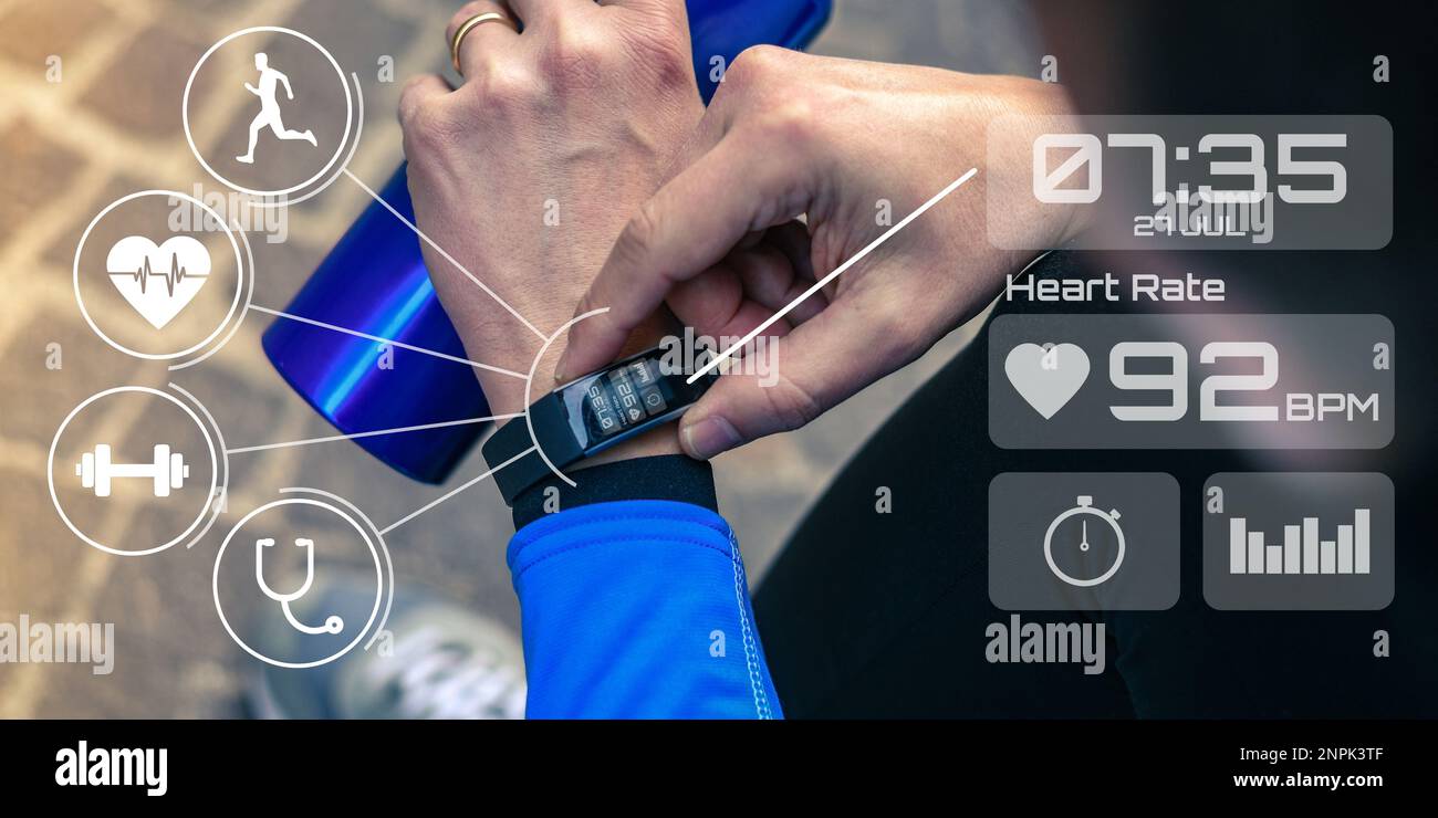 Man running in the park. Runner check heartbeat, steps and distance ...