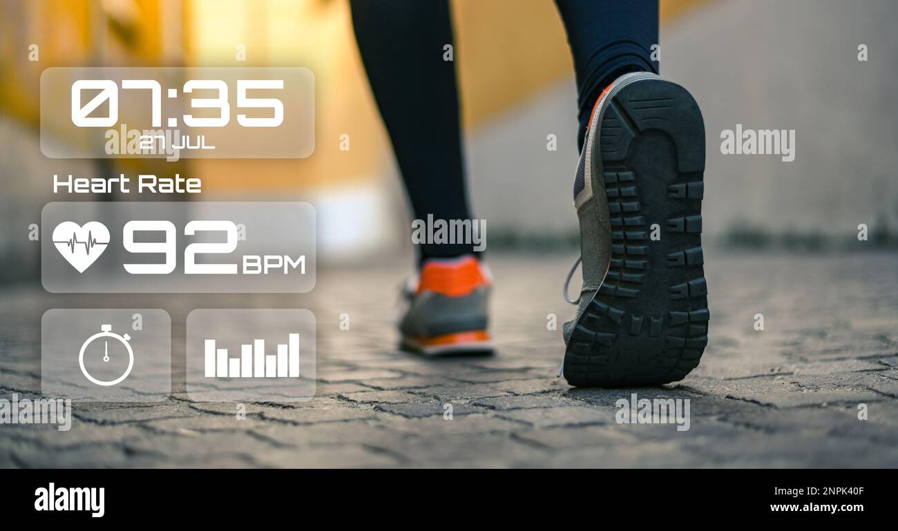 Man running in the park. Runner check heartbeat, steps and distance ...