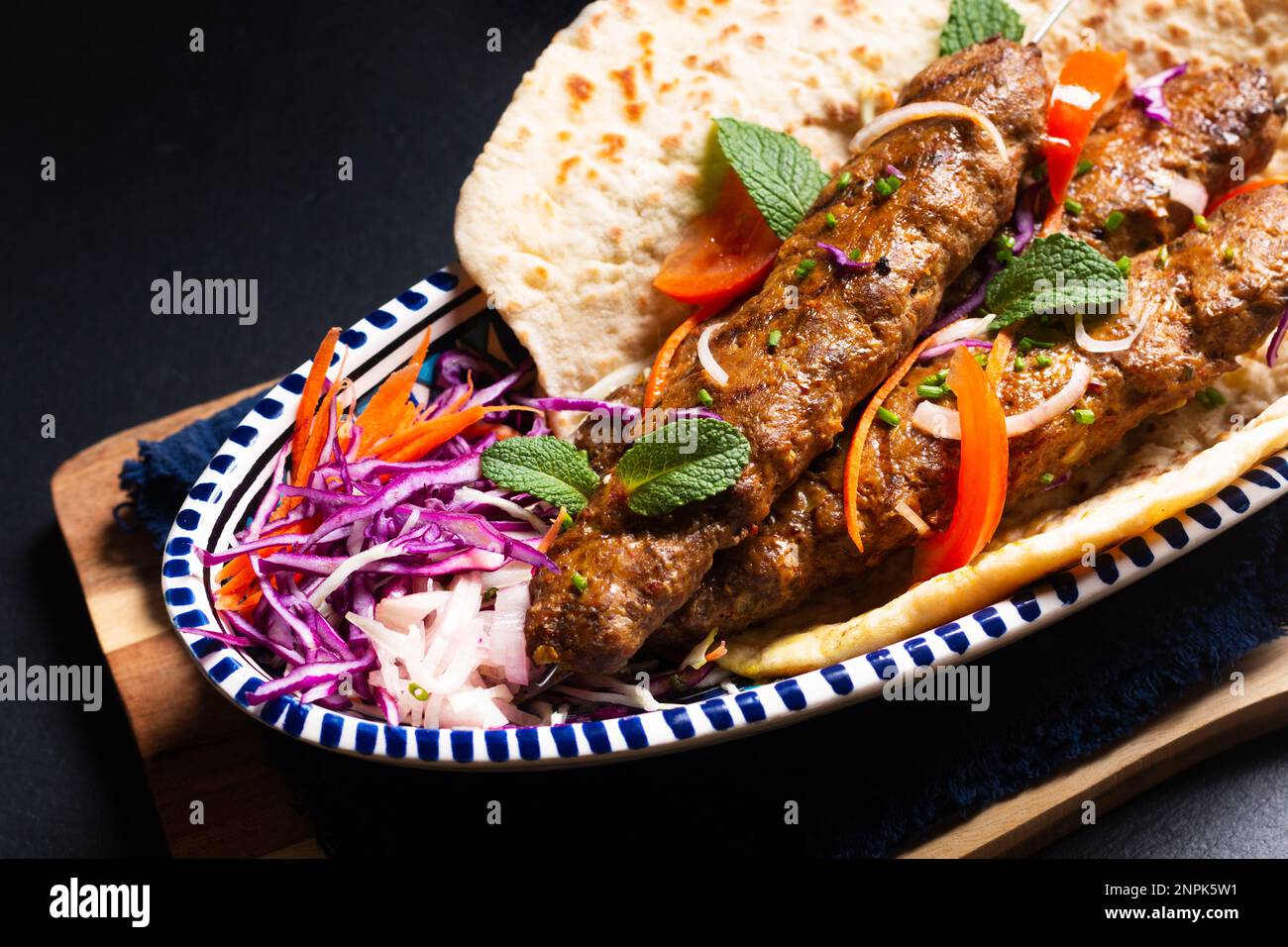 Food concept homemade Shish kofta Kebab on black slate stone background ...