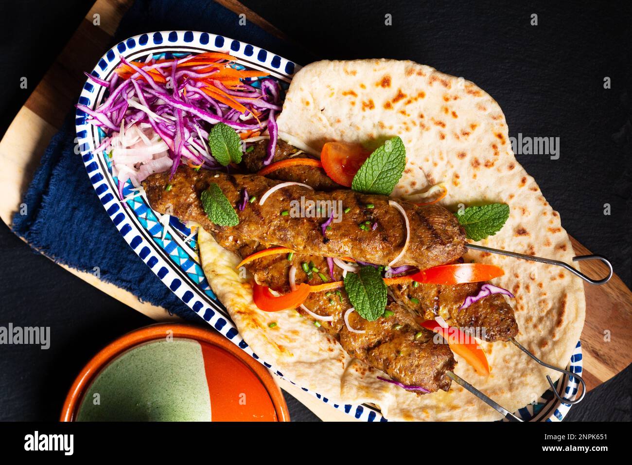 Food concept homemade Shish kofta Kebab on black slate stone background ...