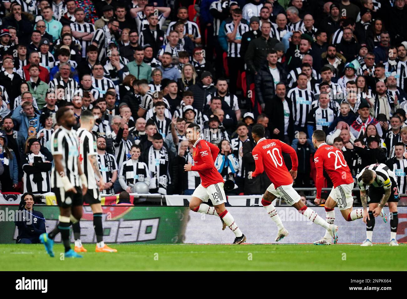 Manchester United's Casemiro (left) celebrates scoring their side's ...