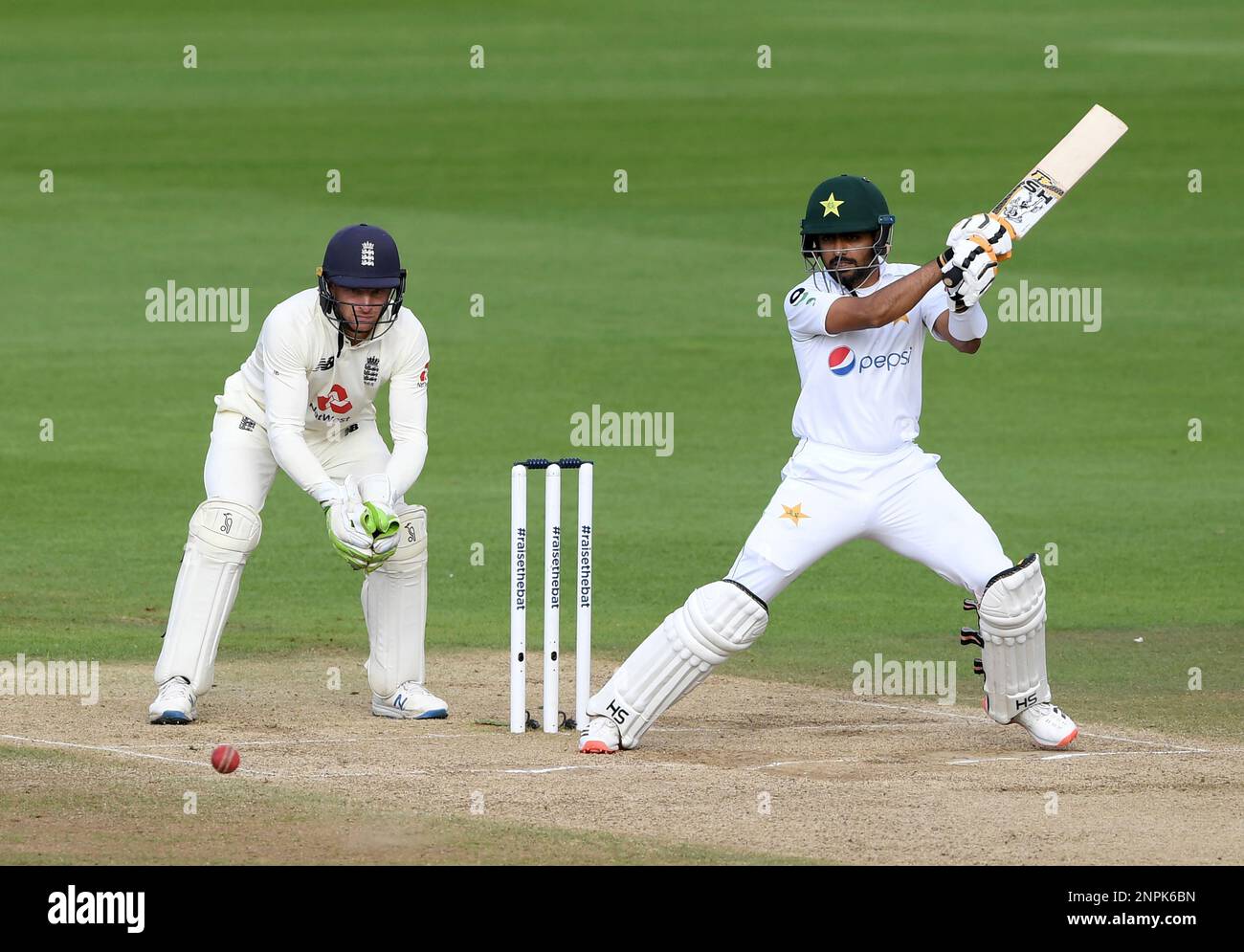 Pakistan's Babar Azam, right, plays a shot during the fifth day of the ...