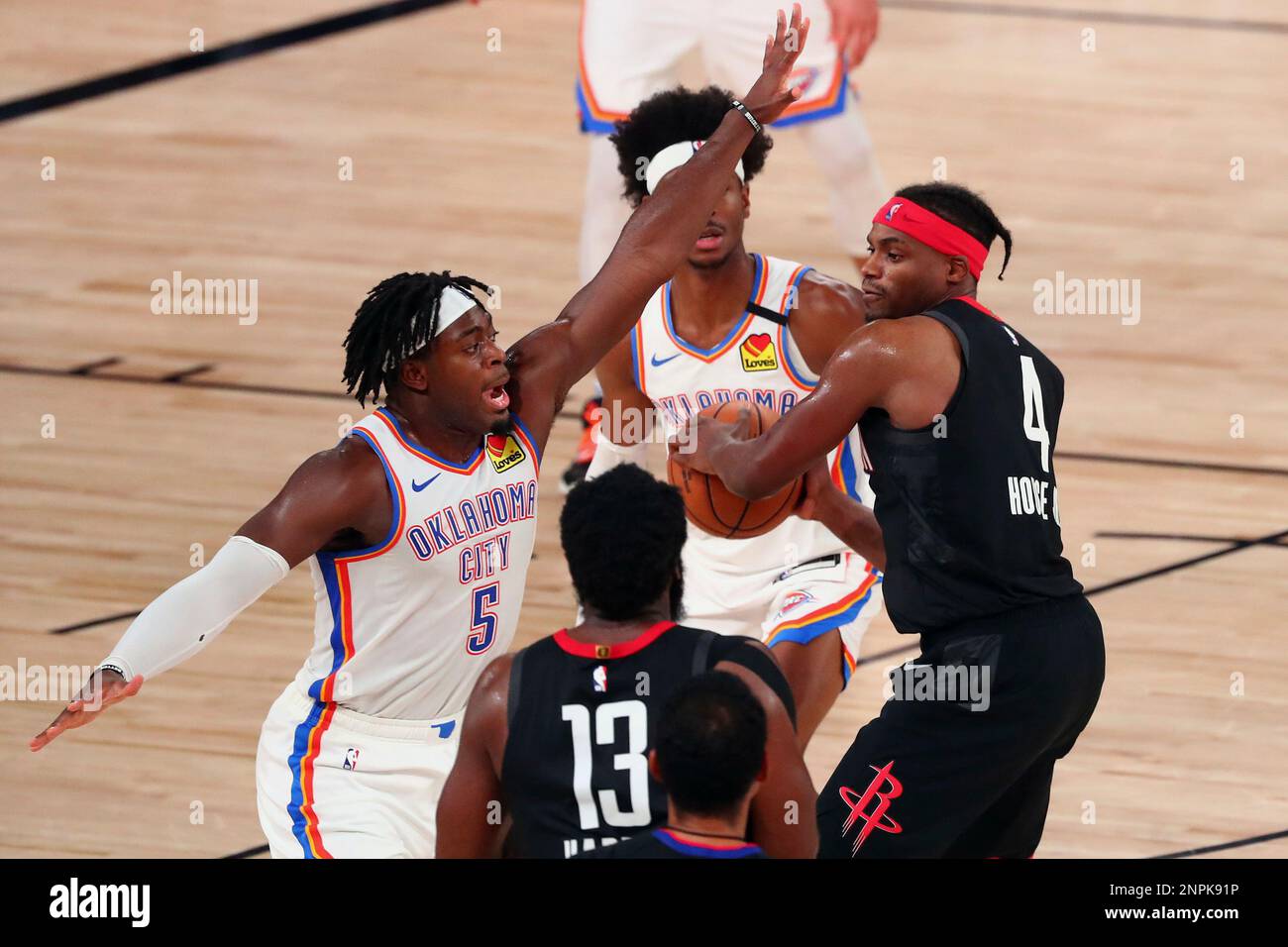 Houston Rockets forward Danuel House Jr., right, controls the ball ...
