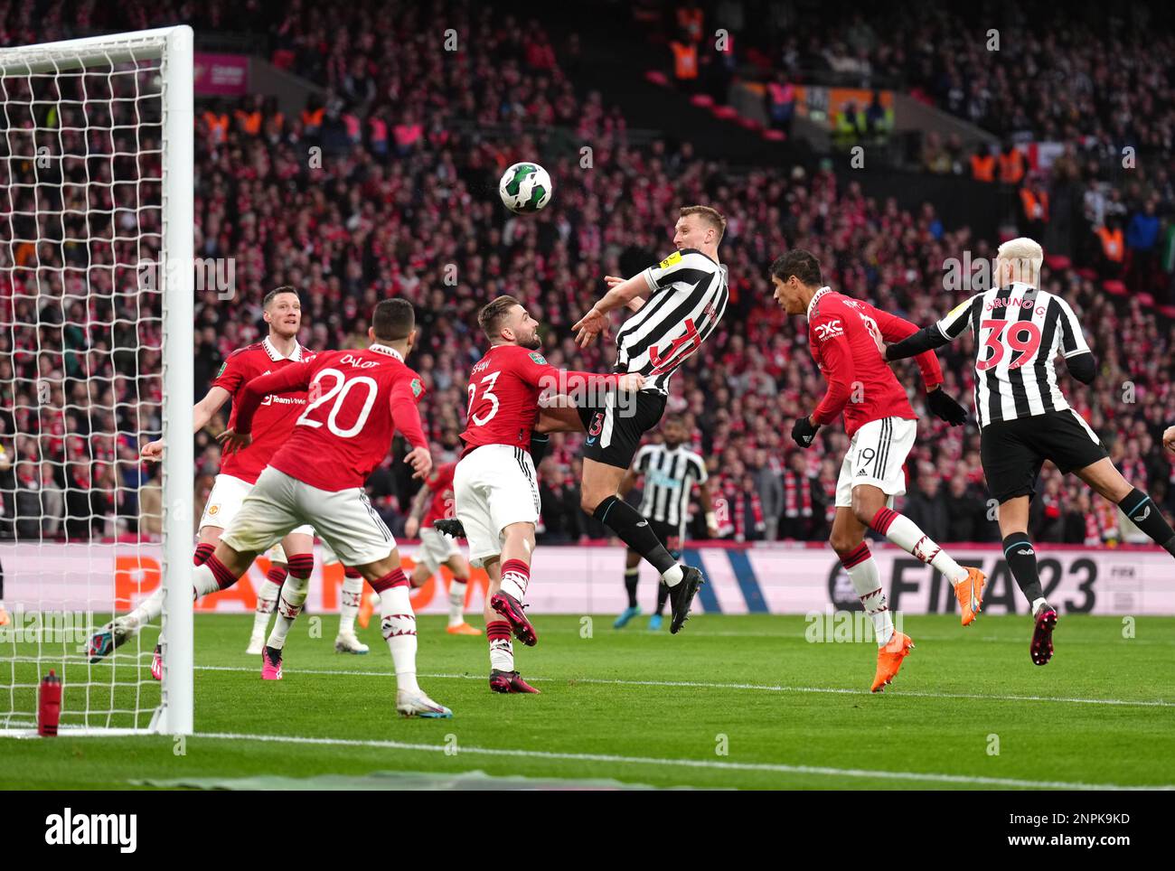Newcastle United's Dan Burn (centre) heads towards goal during the ...