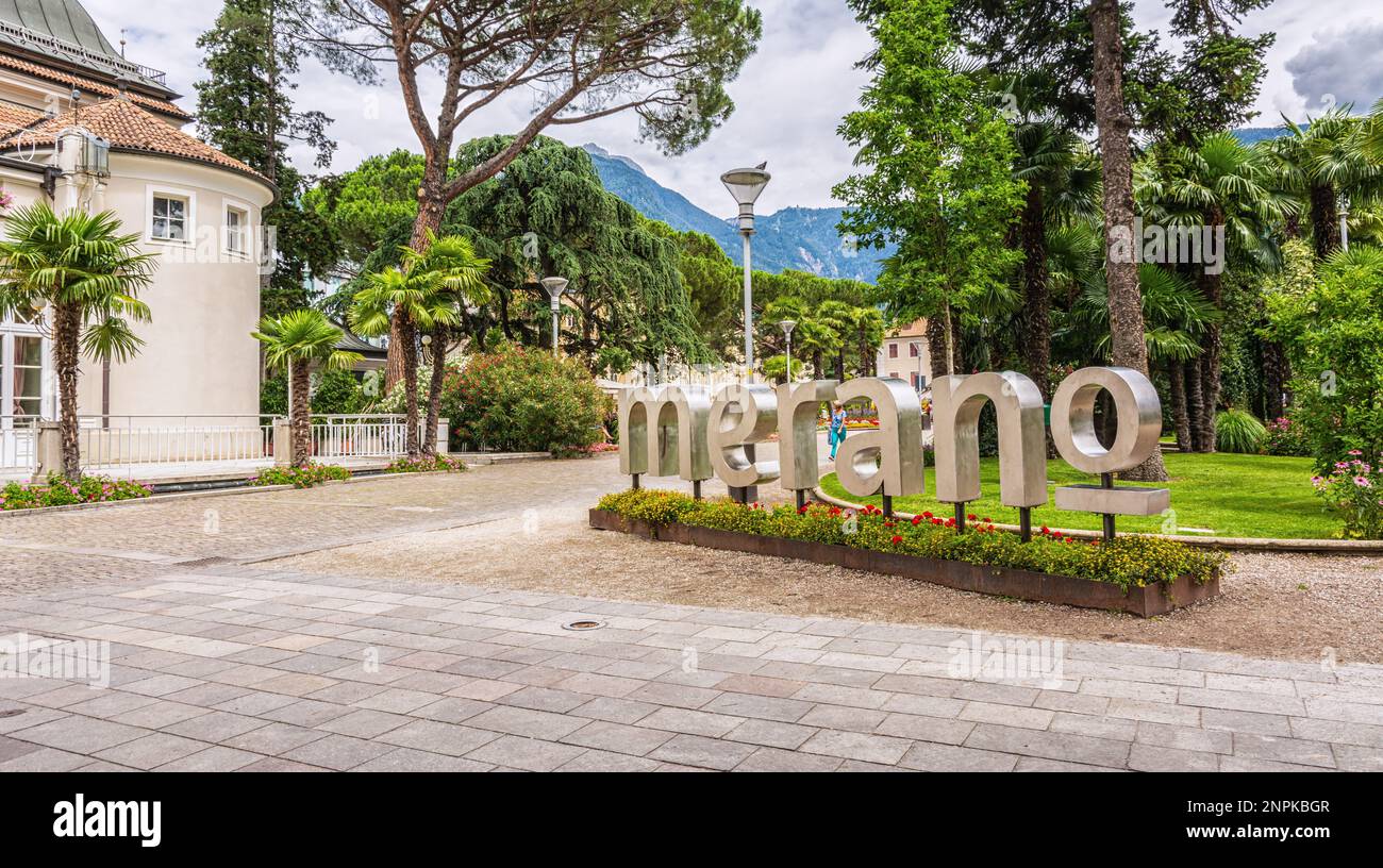Glimpse of the historic center of Merano with Merano in metal letter ...