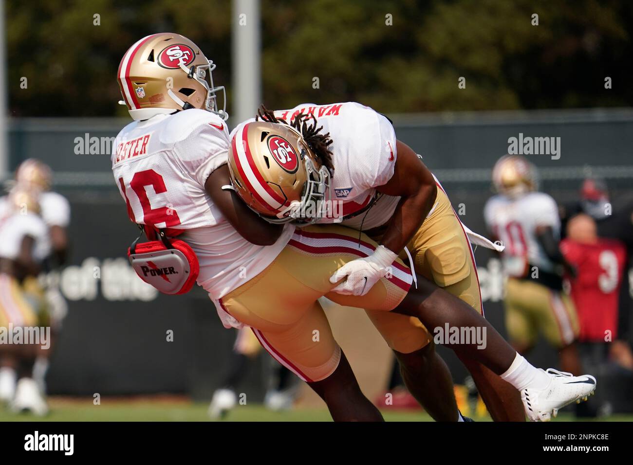 San Francisco 49ers linebacker Fred Warner, right, tackles defensive ...
