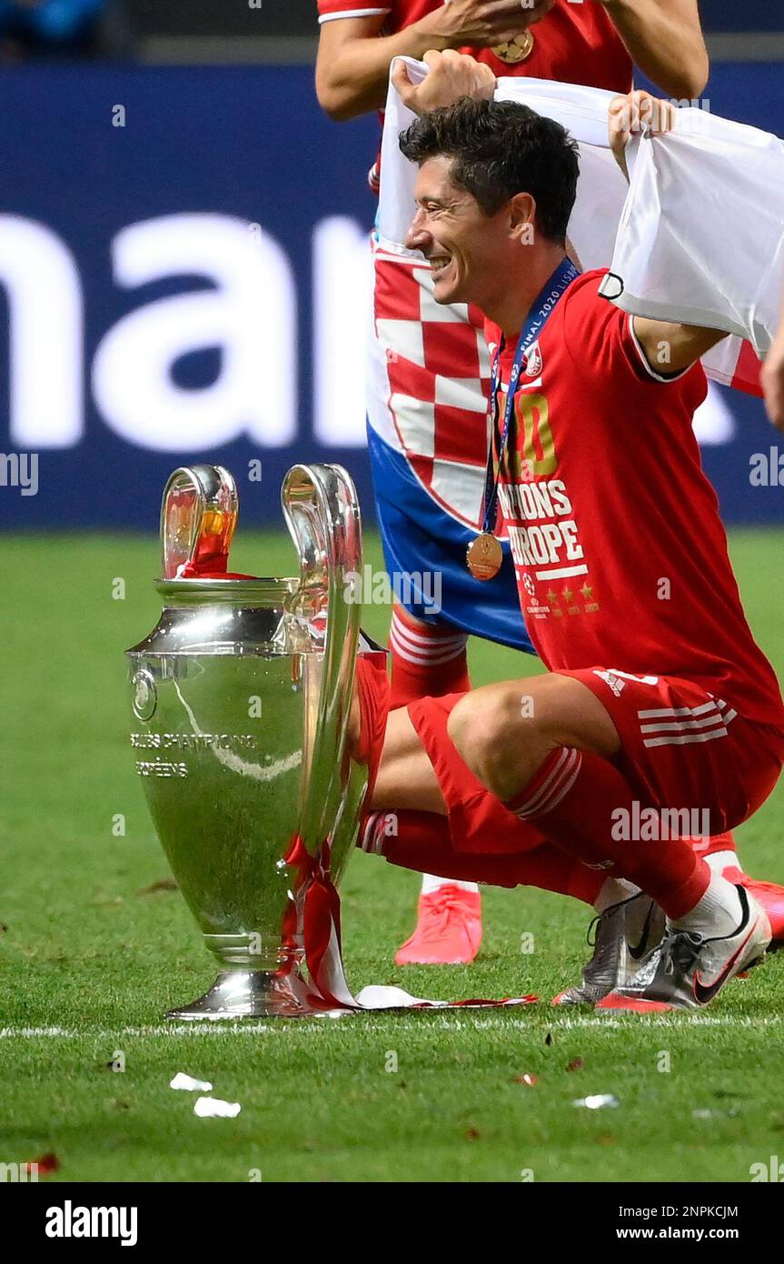 Bayern's Robert Lewandowski poses with the trophy after Bayern Munich ...