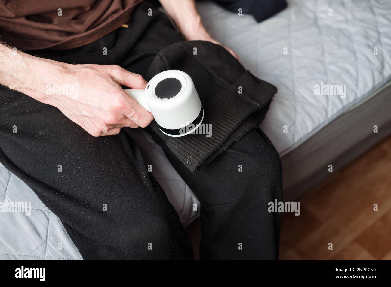 care for and give new life to a knitted hat with a pilling machine ...