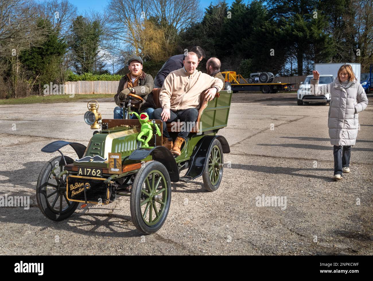Wisborough Green, UK, 26 Feb 2023. A group of men aboard a 1904 De Dion ...