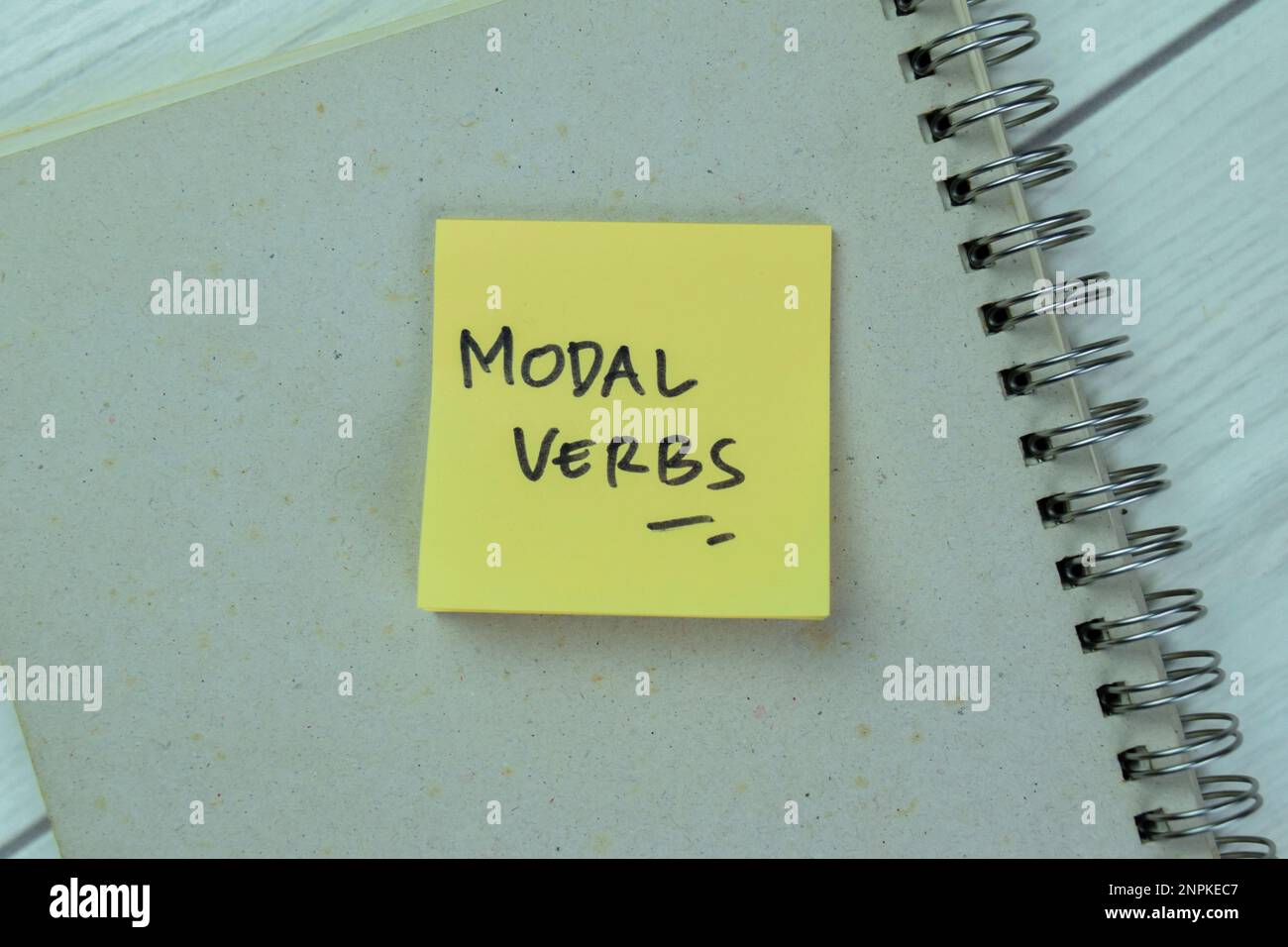 Concept of Modal Verbs write on sticky notes isolated on Wooden Table ...