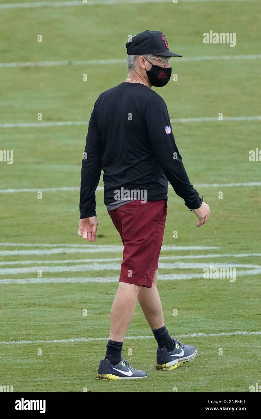 Atlanta Falcons general manager Thomas Dimitroff walks across the field ...