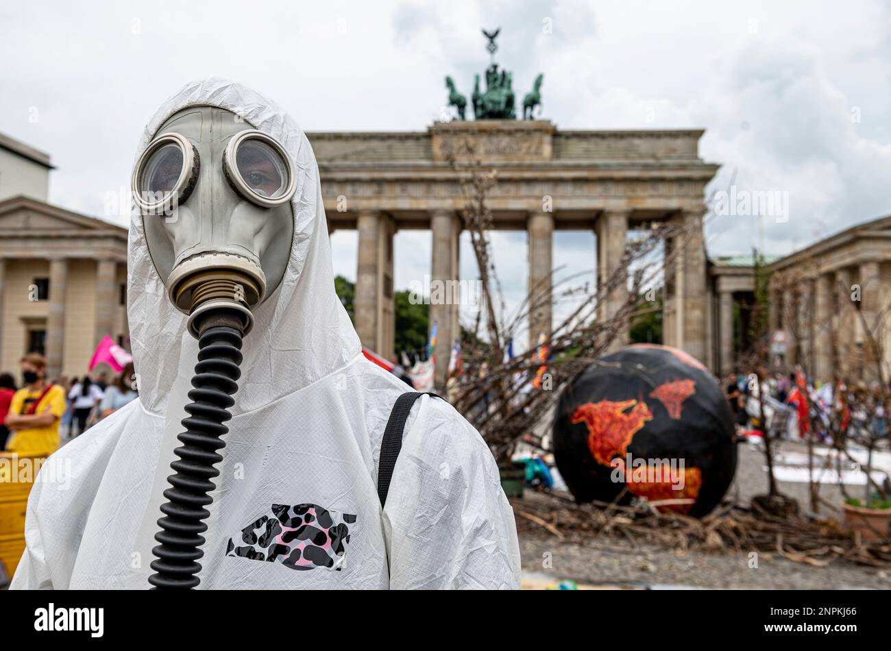 An activist from Extinction Rebellion wears a gas mask in front of the ...