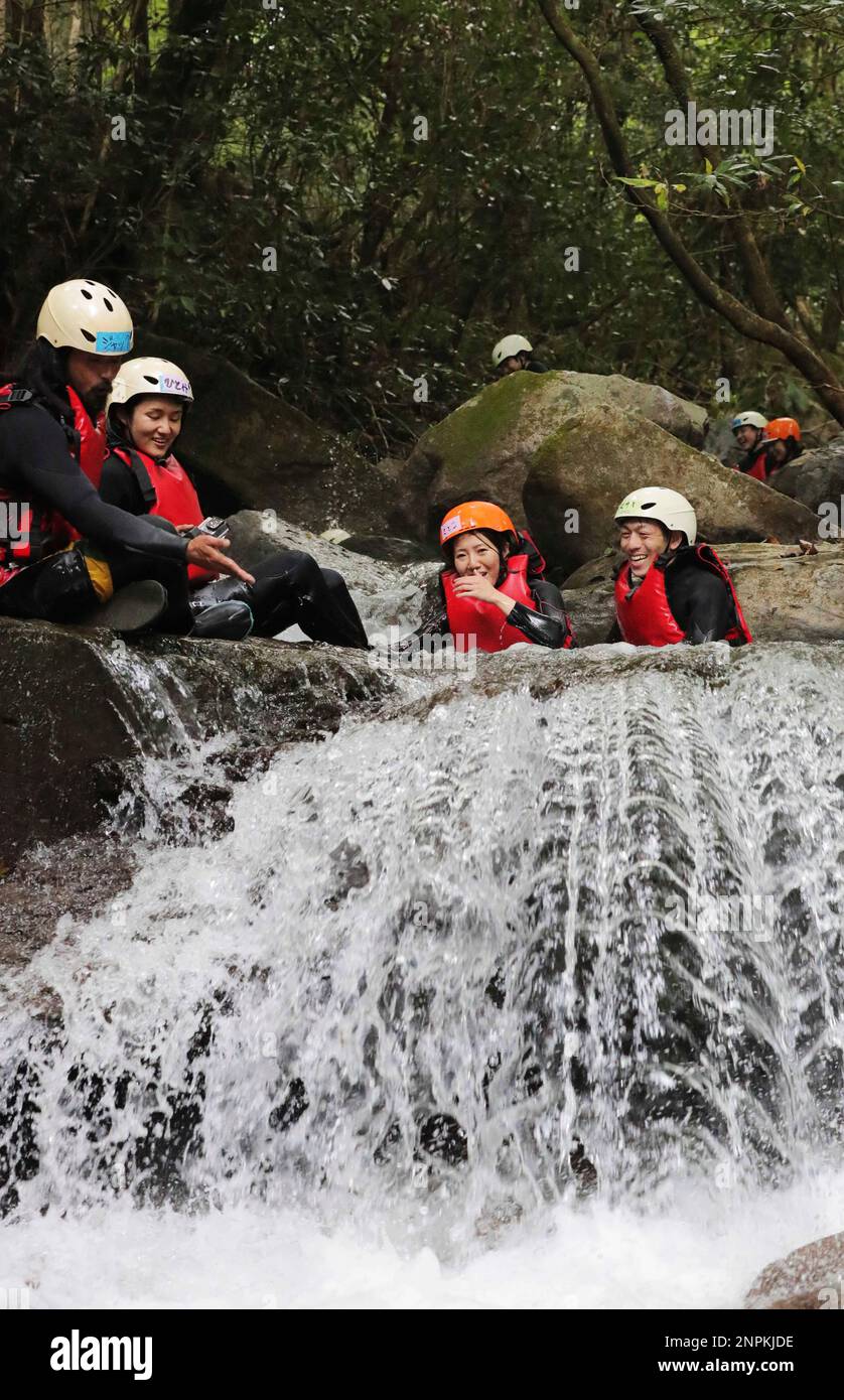 People enjoy canyoning at a river in Hitoyoshi City, Kumamoto ...