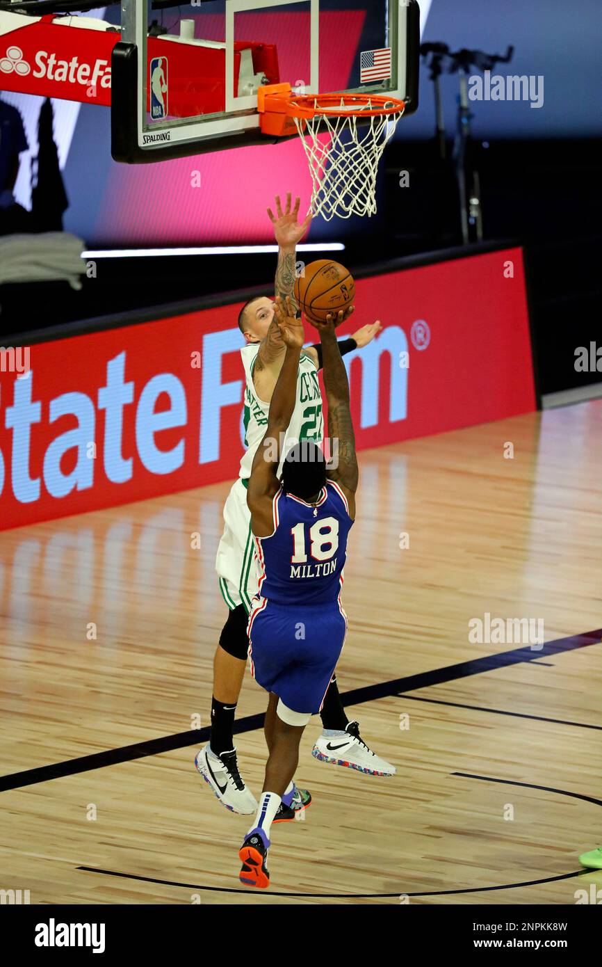 Philadelphia 76ers guard Shake Milton (18) shoots over Boston Celtics ...