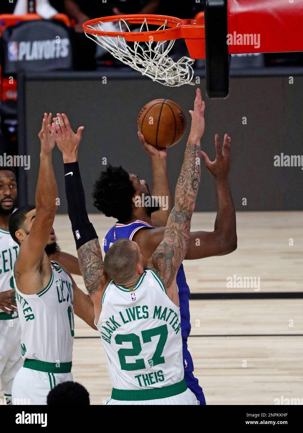 Philadelphia 76ers center Joel Embiid (21) shoots around Boston Celtics ...