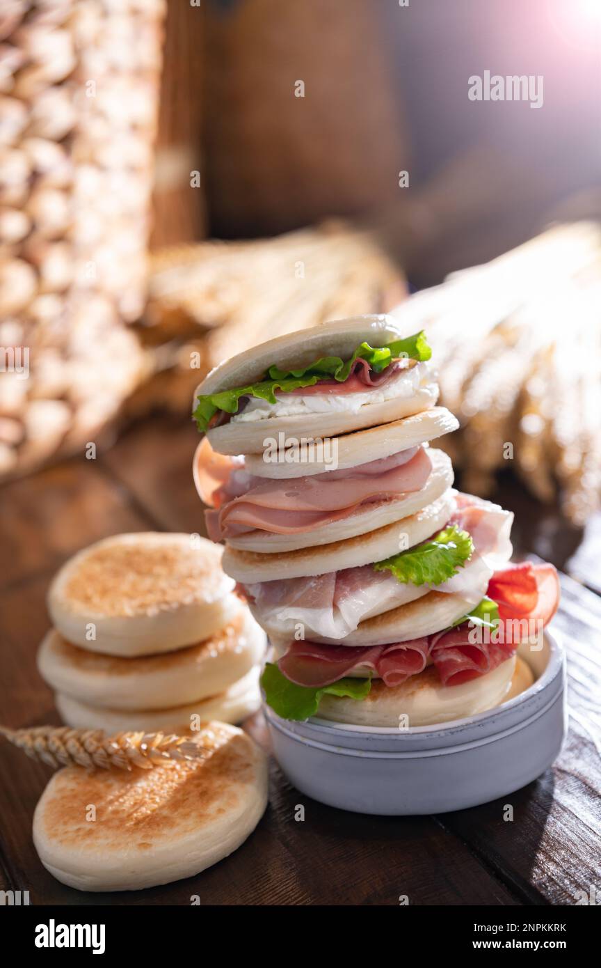 tigelle or crescentine homemade, con prosciutto, salame, stracciatella ...