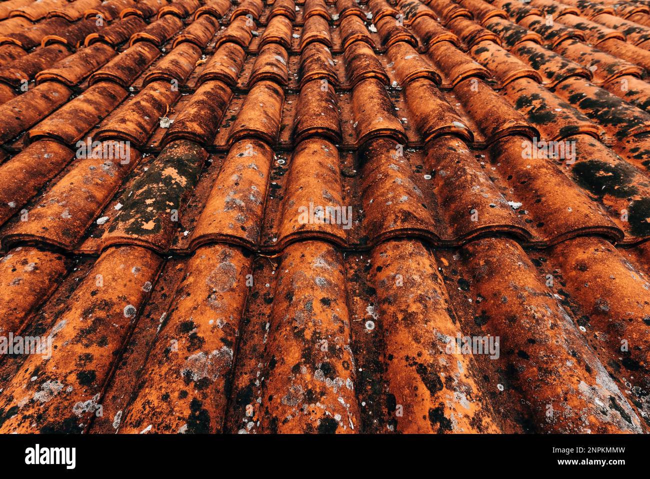 Old rustic terracotta roof tiles pattern as background, architectural ...