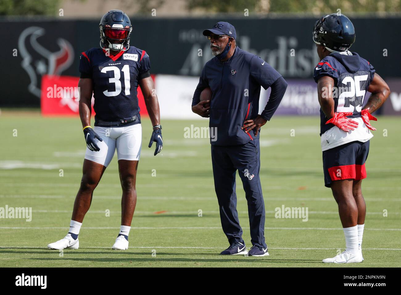 Houston Texans running backs coach Danny Barrett, center, stands with ...