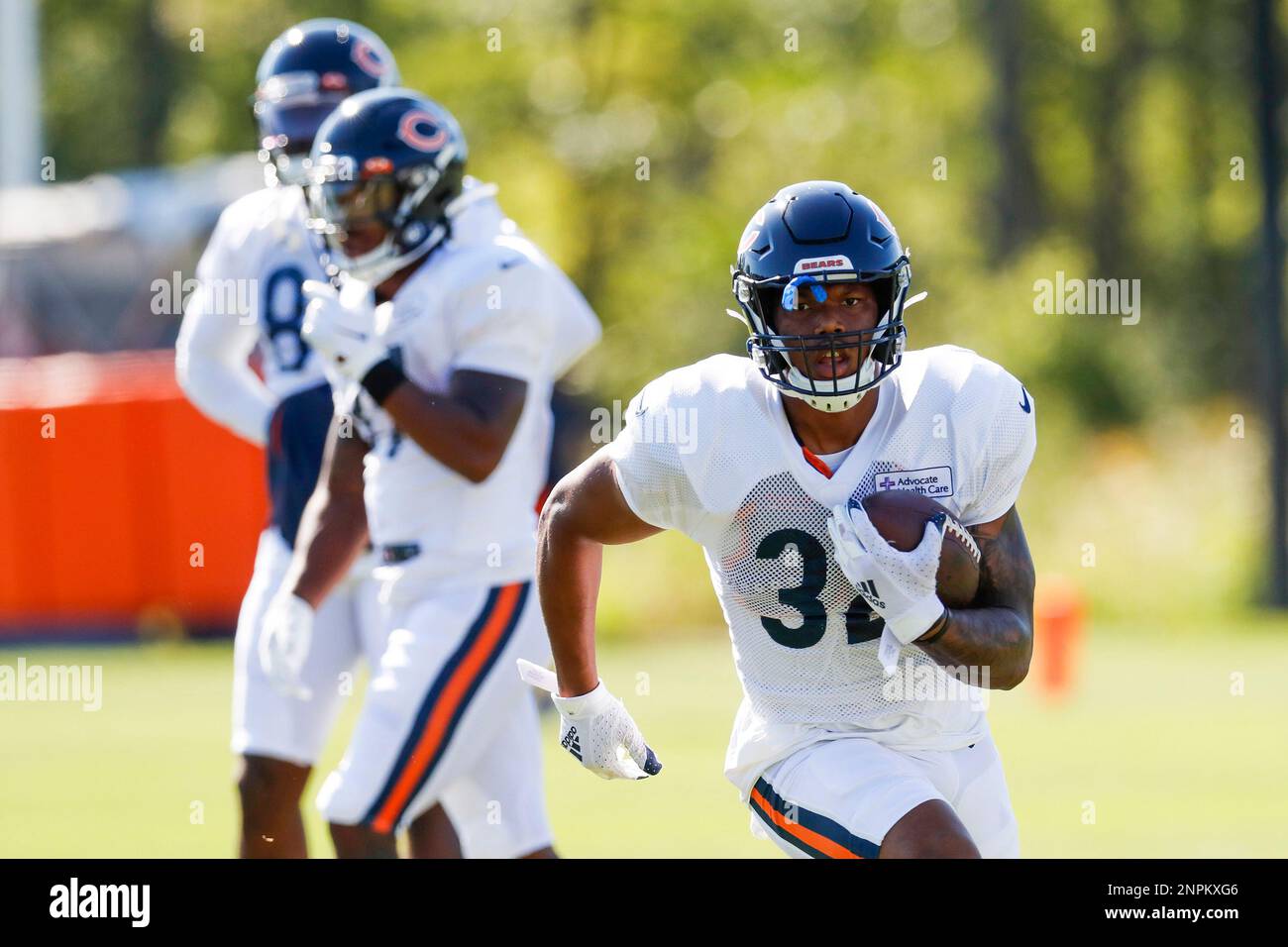 Chicago Bears running back David Montgomery (32) runs with the ball during NFL football training ...