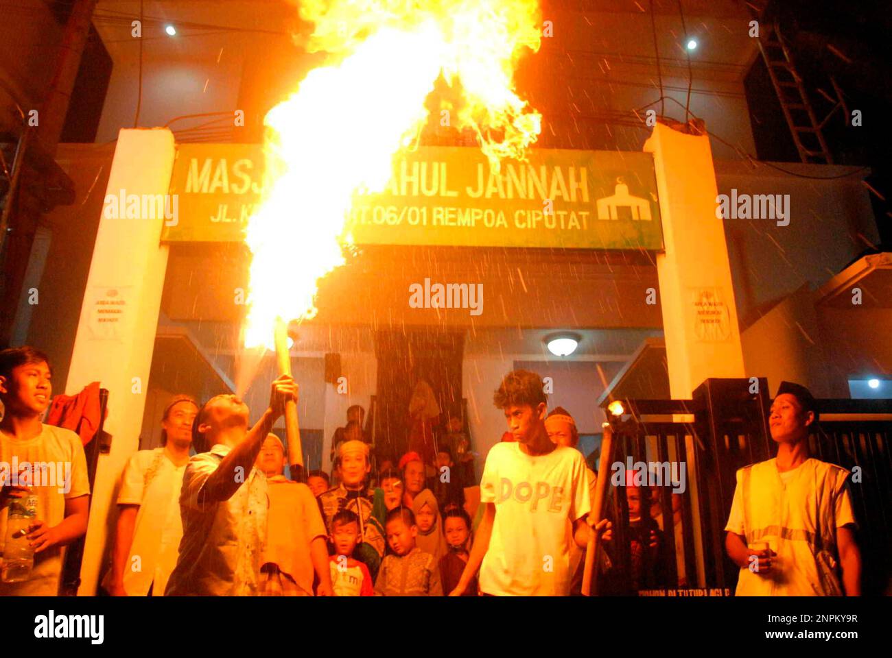 A young Muslim spits fire to celebrate the upcoming Islamic Calendar ...