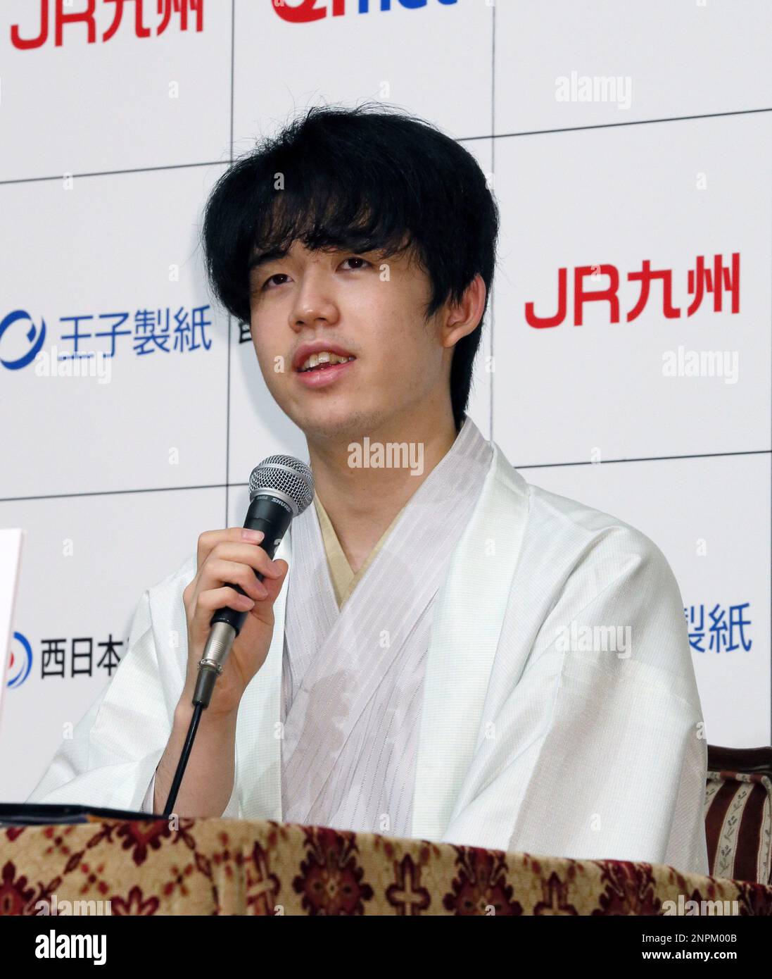 A shogi, Japanese chess player Sota Fujii attends a press conference after beating 47-year-old ...