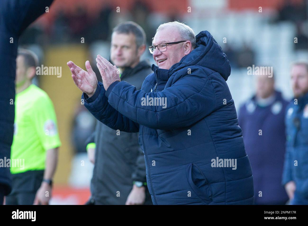 Football manager Steve Evans standing on touchline during game whilst ...