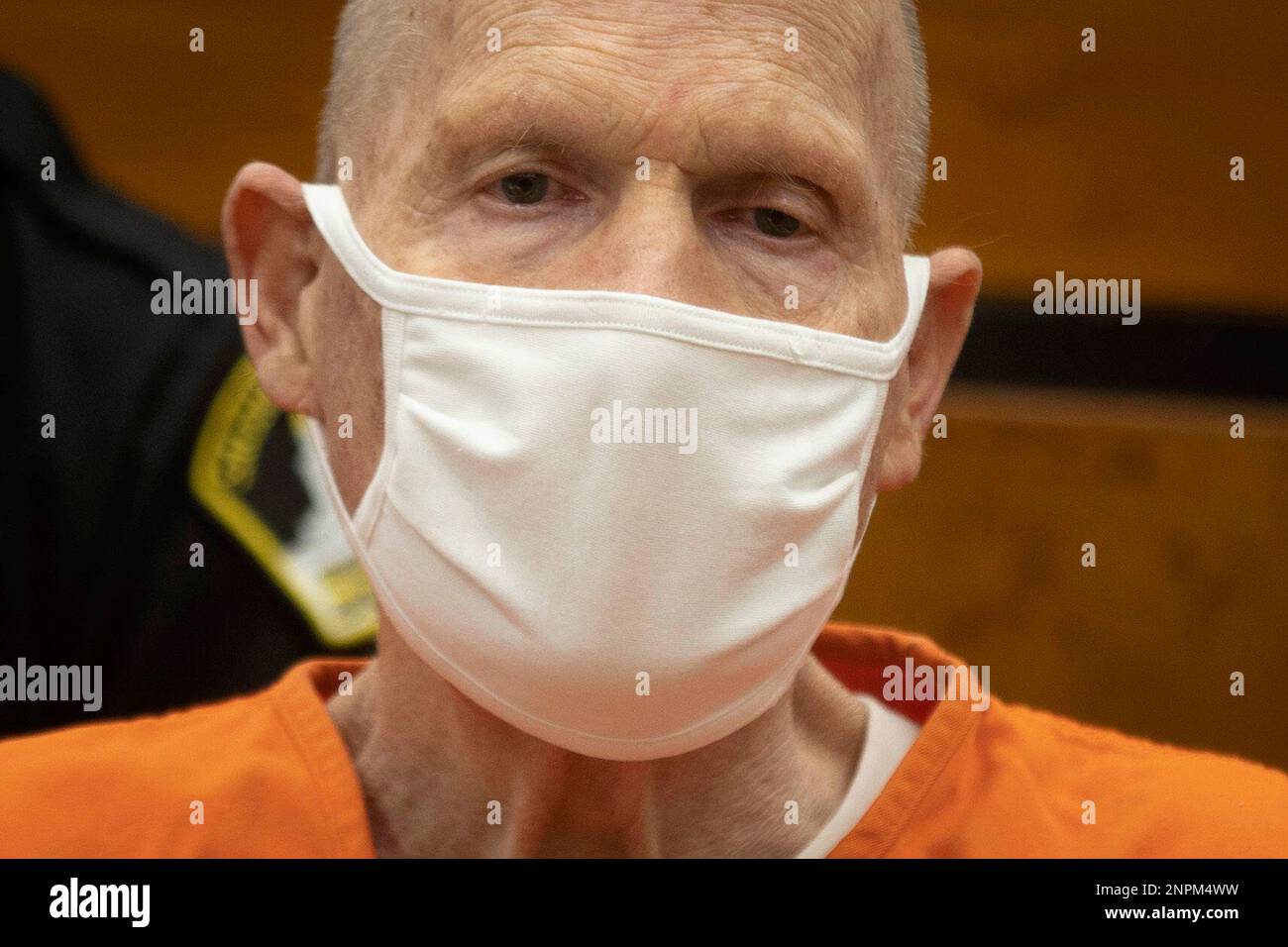 Joseph James DeAngelo looks away from the podium as people who DeAngelo ...