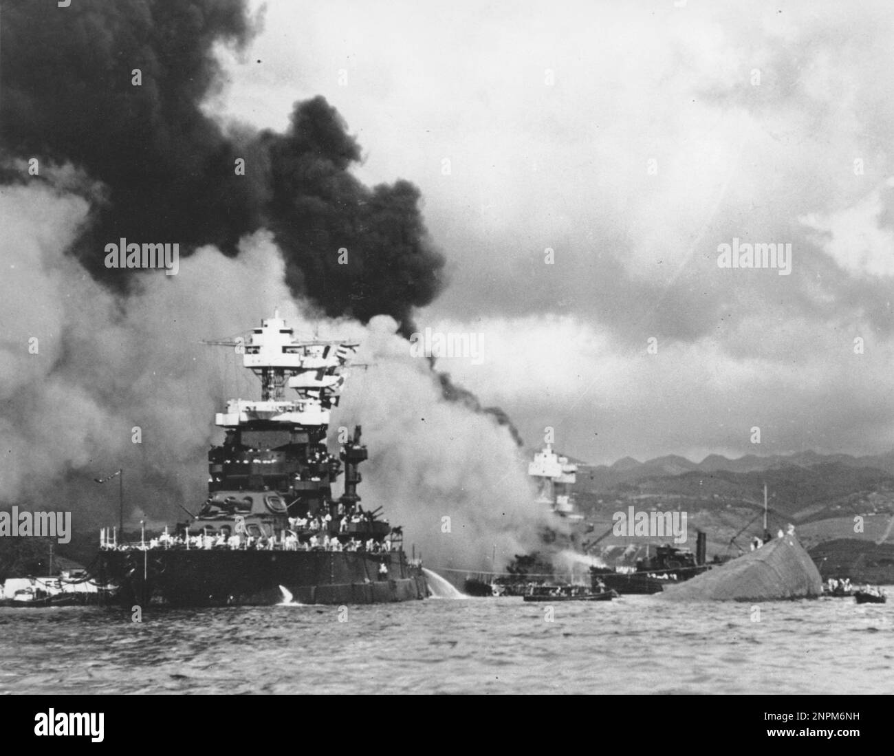 FILE - In this Dec. 7, 1941, file photo, part of the hull of the ...