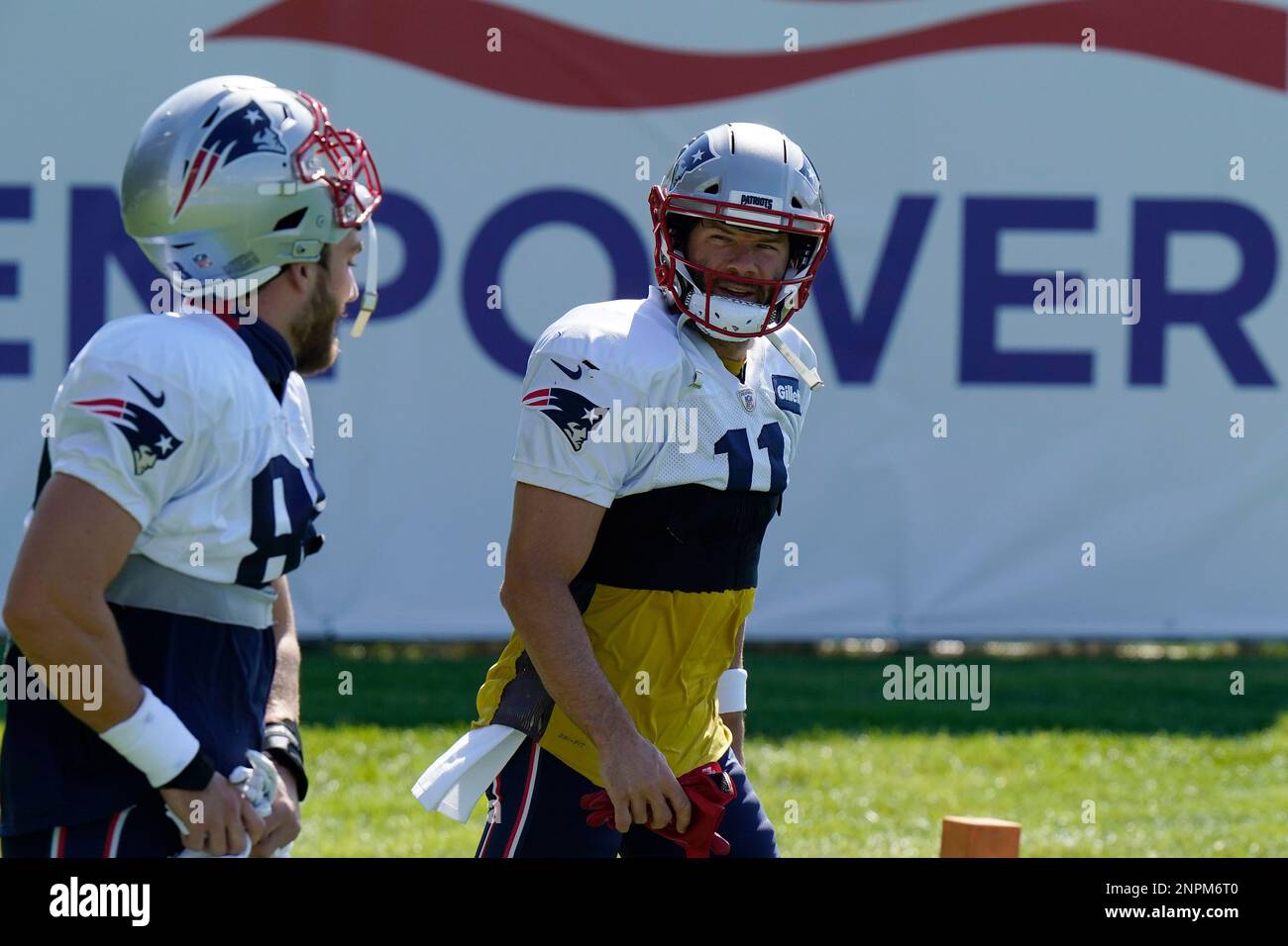 New England Patriots tight end Alex Ellis, left and wide receiver ...