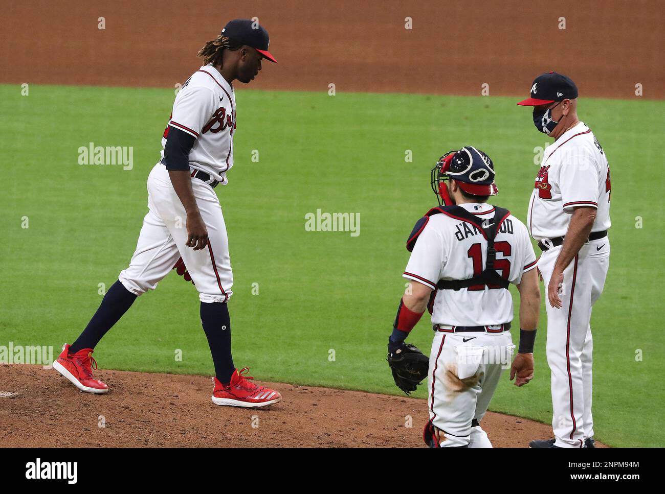 Atlanta Braves manager Brian Snitker, right, pulls starting pitcher ...