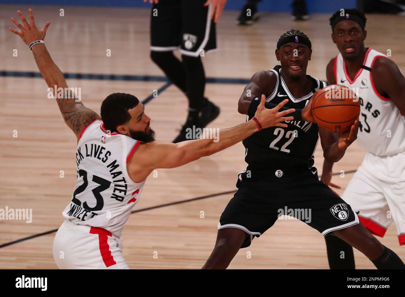 Brooklyn Nets guard Caris LeVert (22) passes the ball past Toronto ...