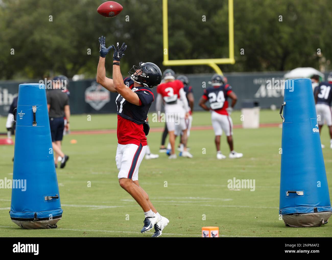 Houston Texans wide receiver Chad Hansen reaches up for a ball during ...