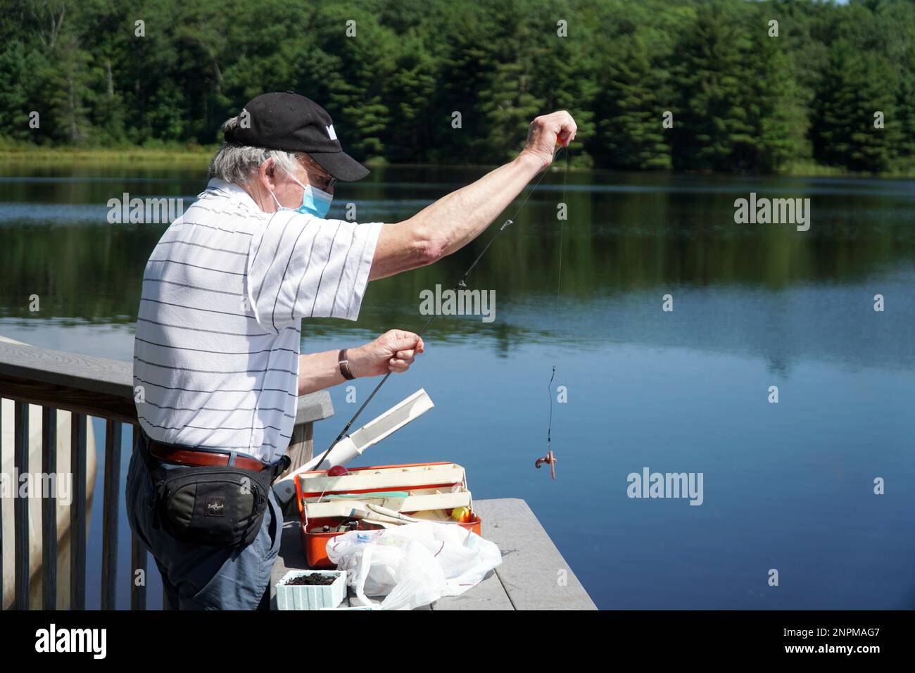 Joe Berger casts worms for bass at Benedict Pond in Great Barrington ...