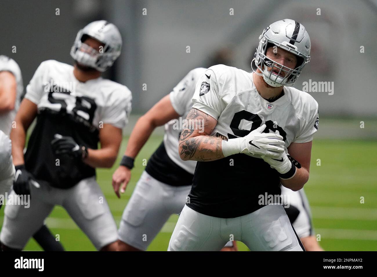 Las Vegas Raiders defensive end Maxx Crosby stretches during an NFL ...