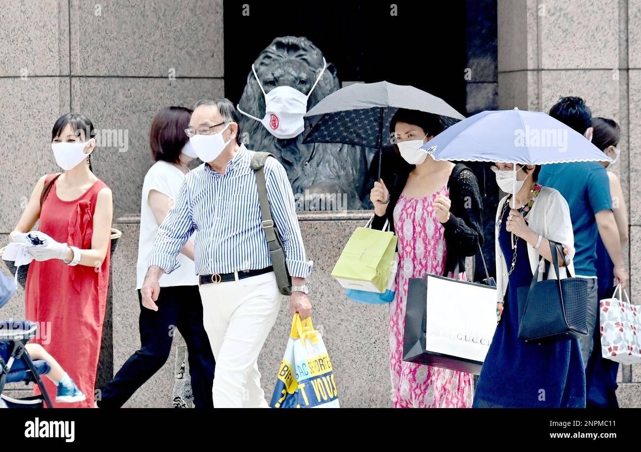 People wearing masks are seen at Ginza district in Tokyo on Aug. 17 ...