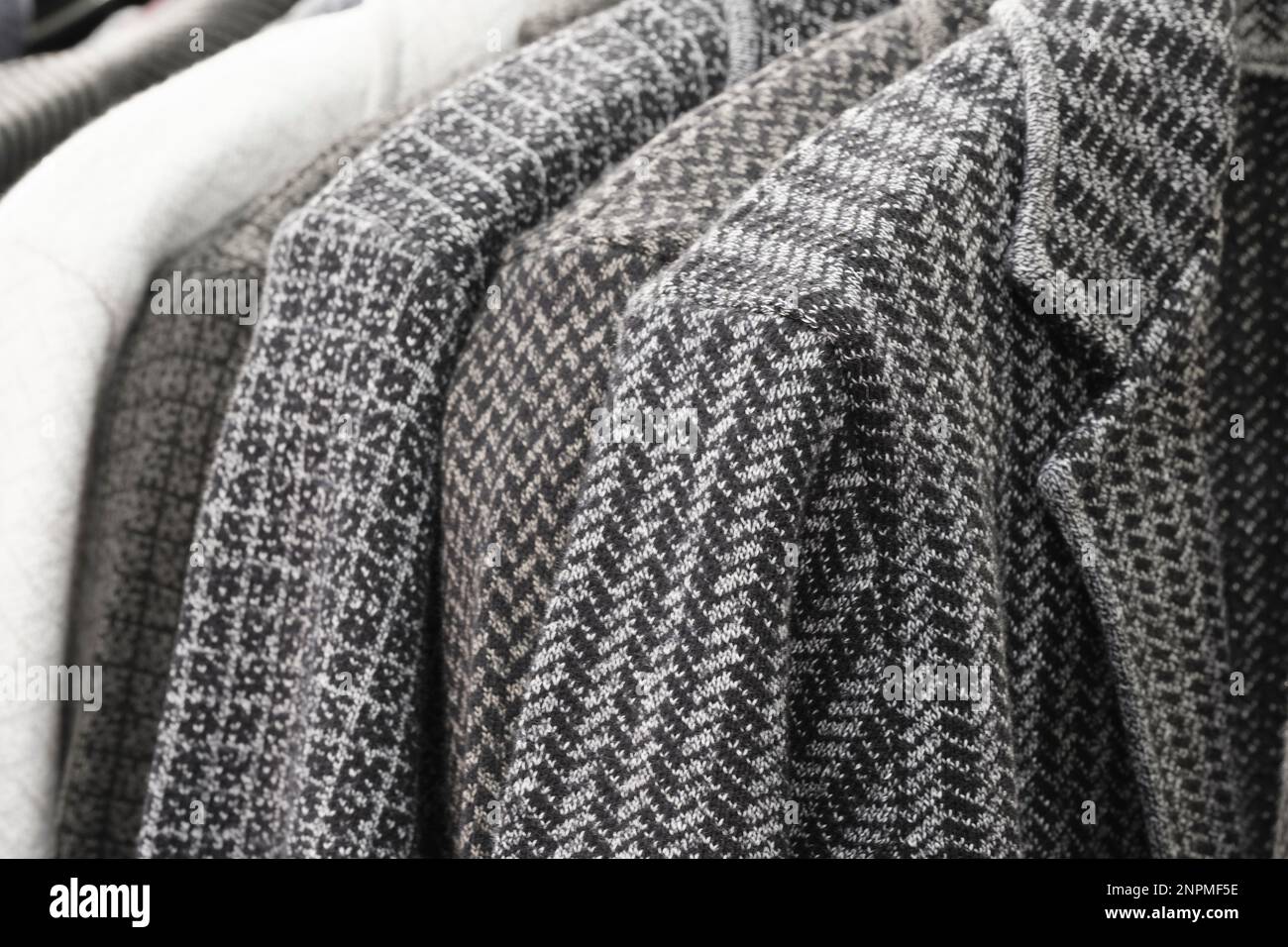 Winter clothes hanged on a clothes rack Stock Photo - Alamy
