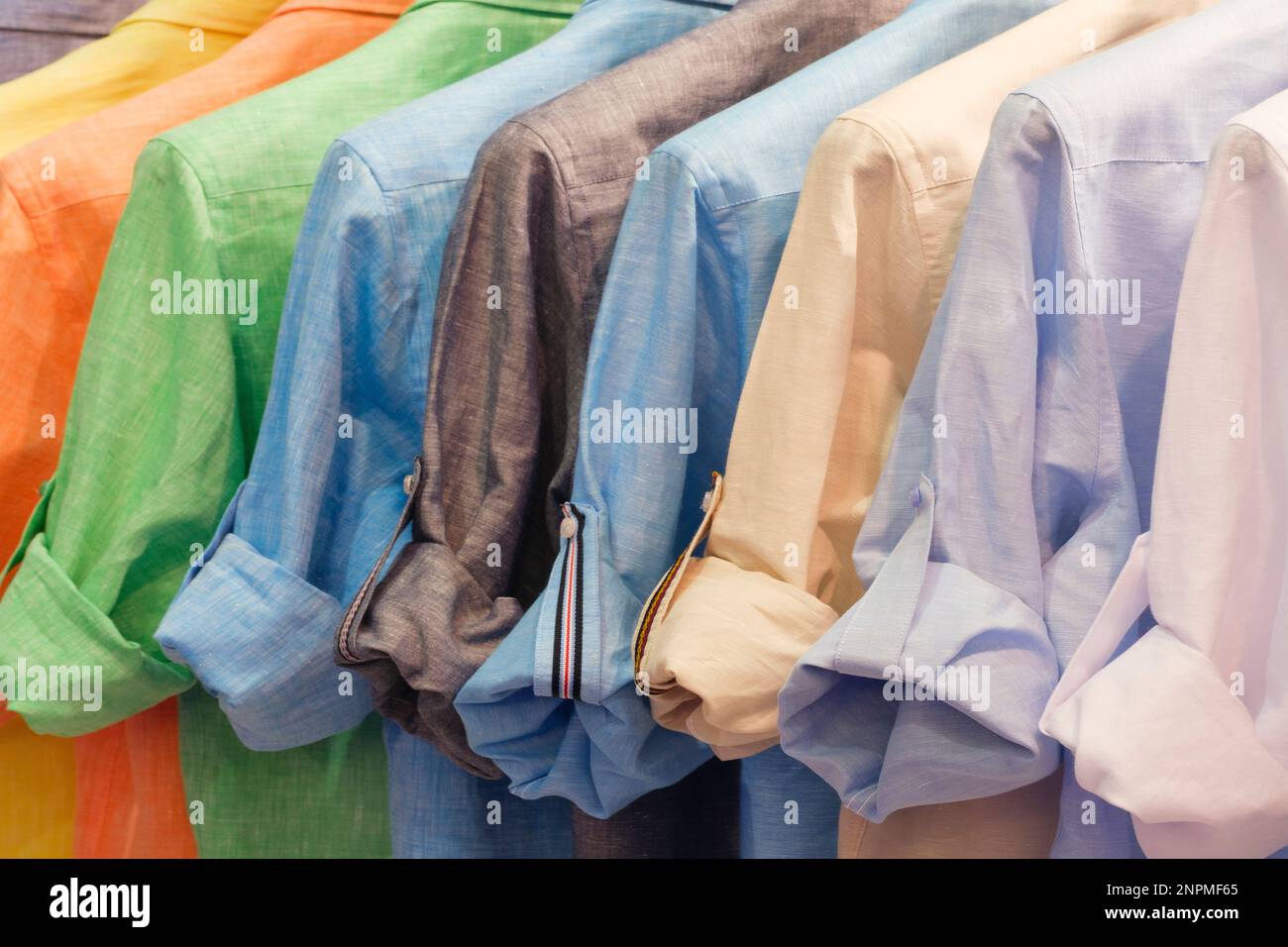 linen shirts, Fashion clothes on clothing rack - bright colorful closet ...