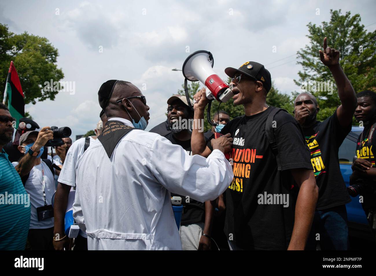Rabbi Michael Ben Yosef tries to appease counter-protesters during an ...