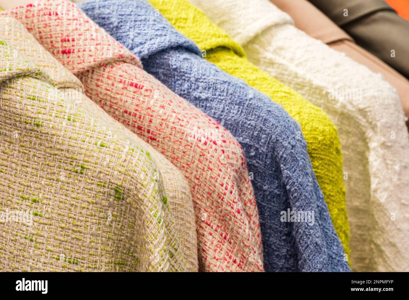 Fashion clothes on clothing rack - bright colorful closet. Closeup of ...