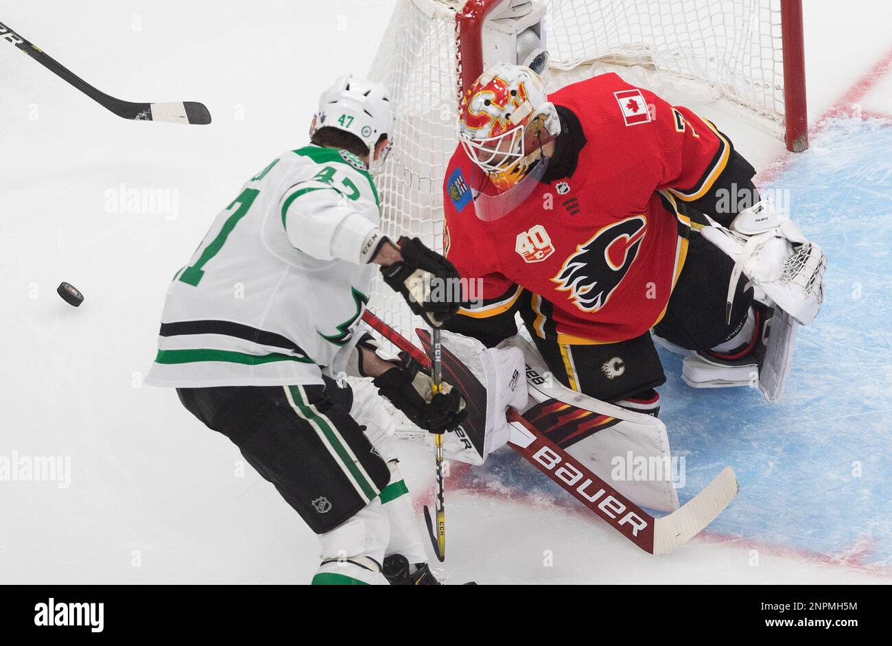 Calgary Flames goalie Cam Talbot (39) stops Dallas Stars' Alexander ...