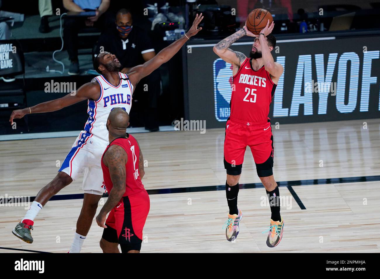Houston Rockets' Austin Rivers (25) shoots over Philadelphia 76ers ...