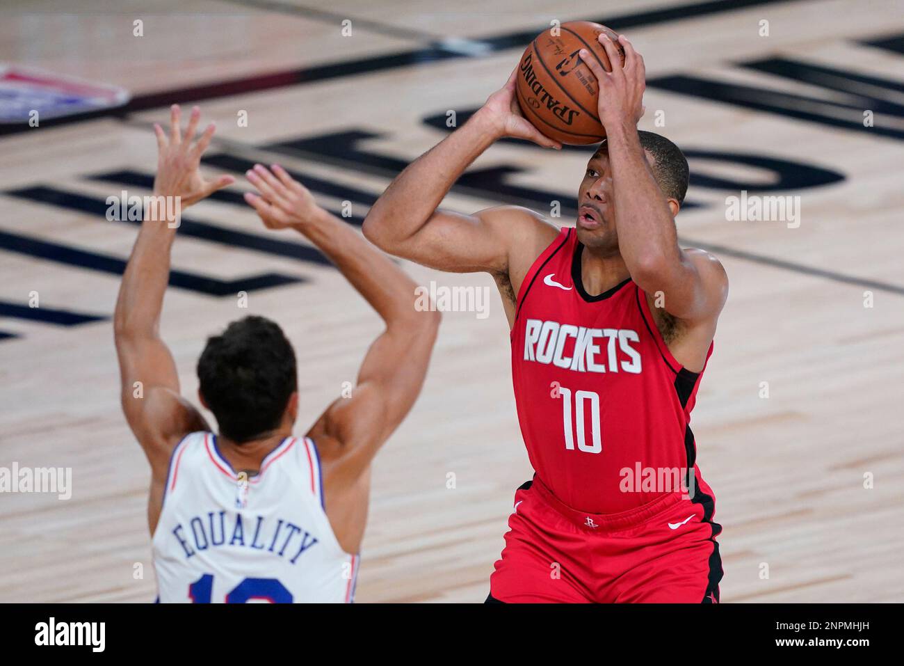 Houston Rockets' Eric Gordon (10) shoots over Philadelphia 76ers' Raul ...