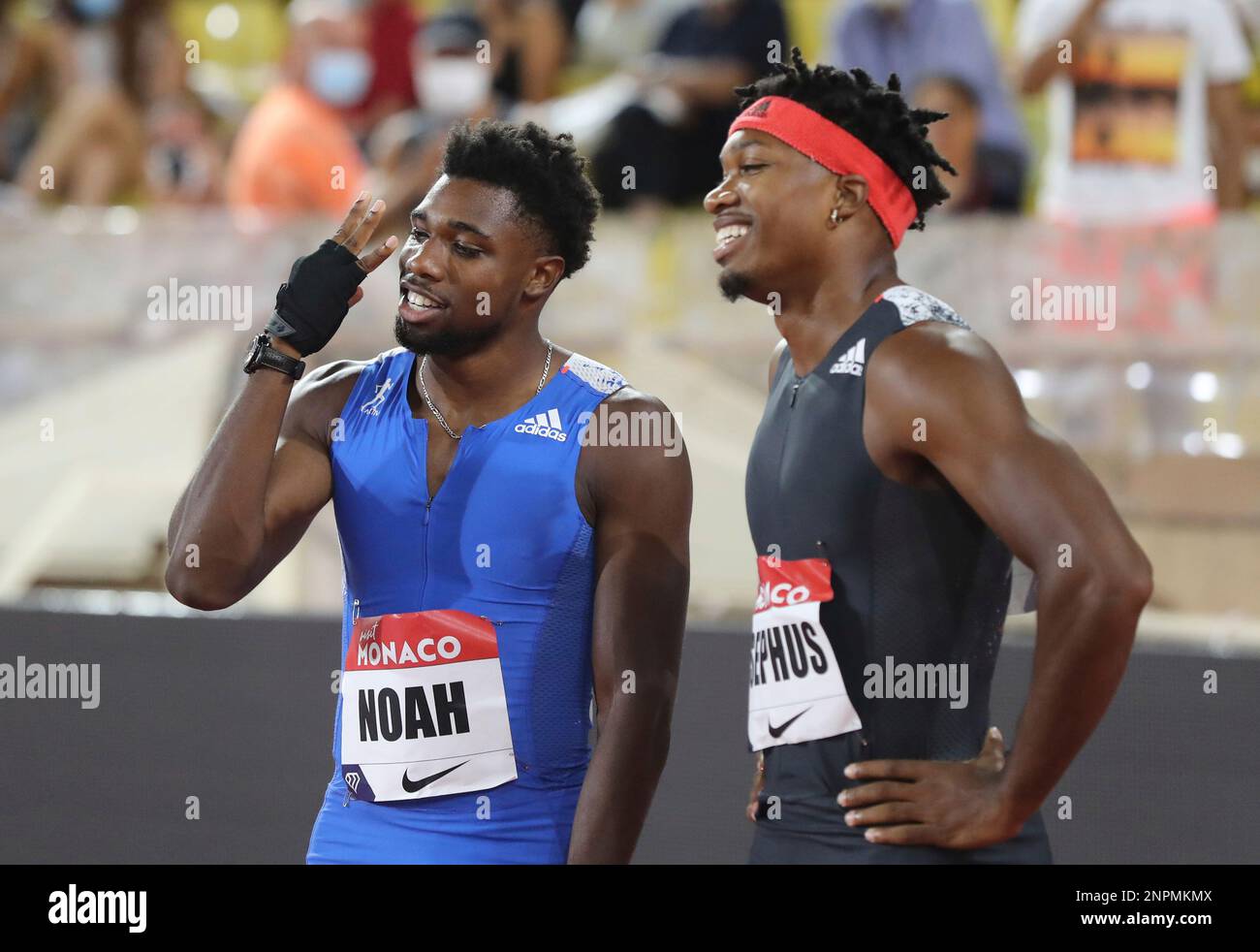 United States' Noah Lyles, left, celebrates after winning the men's 200 ...