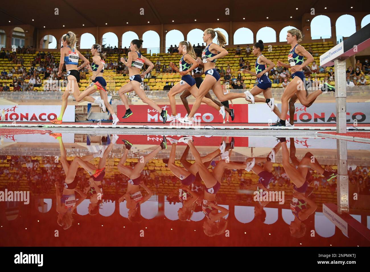 Competitors run during the the women's 5000 meter final of the Diamond ...
