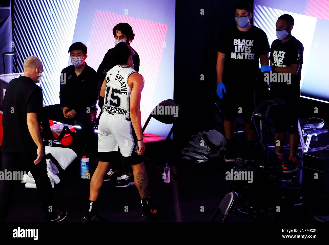 San Antonio Spurs' Quinndary Weatherspoon (15) limps off the court ...