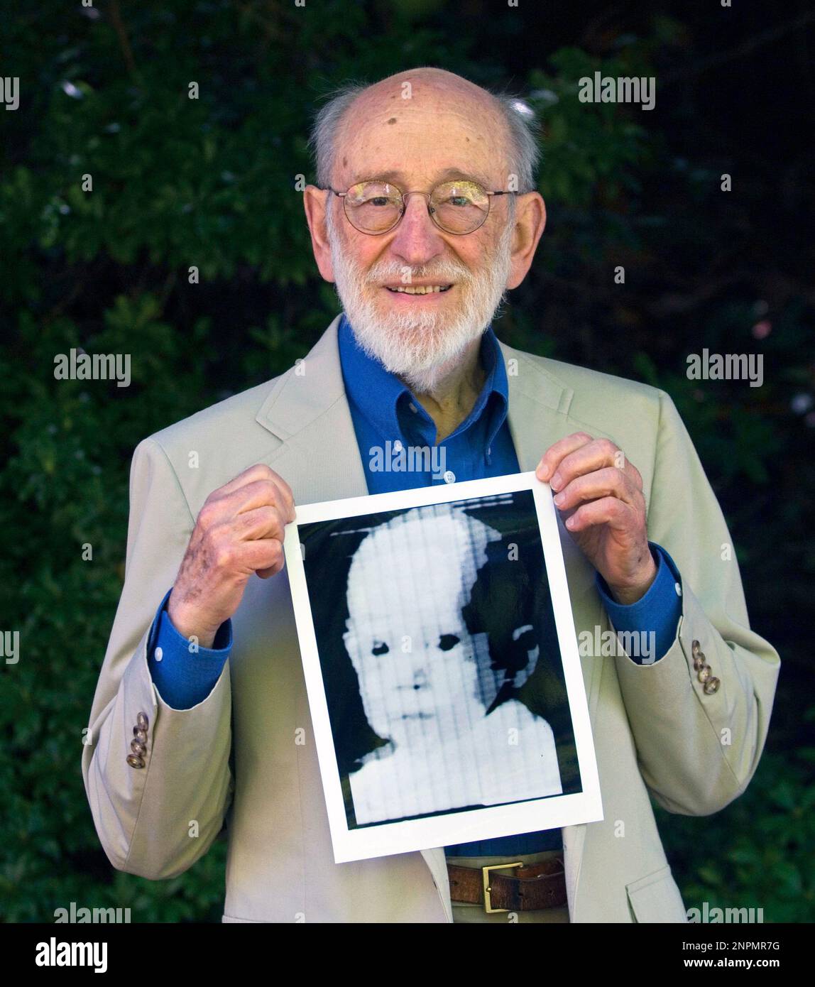 FILE - In this 2007 file photo ,Russell Kirsch holds the image of his ...