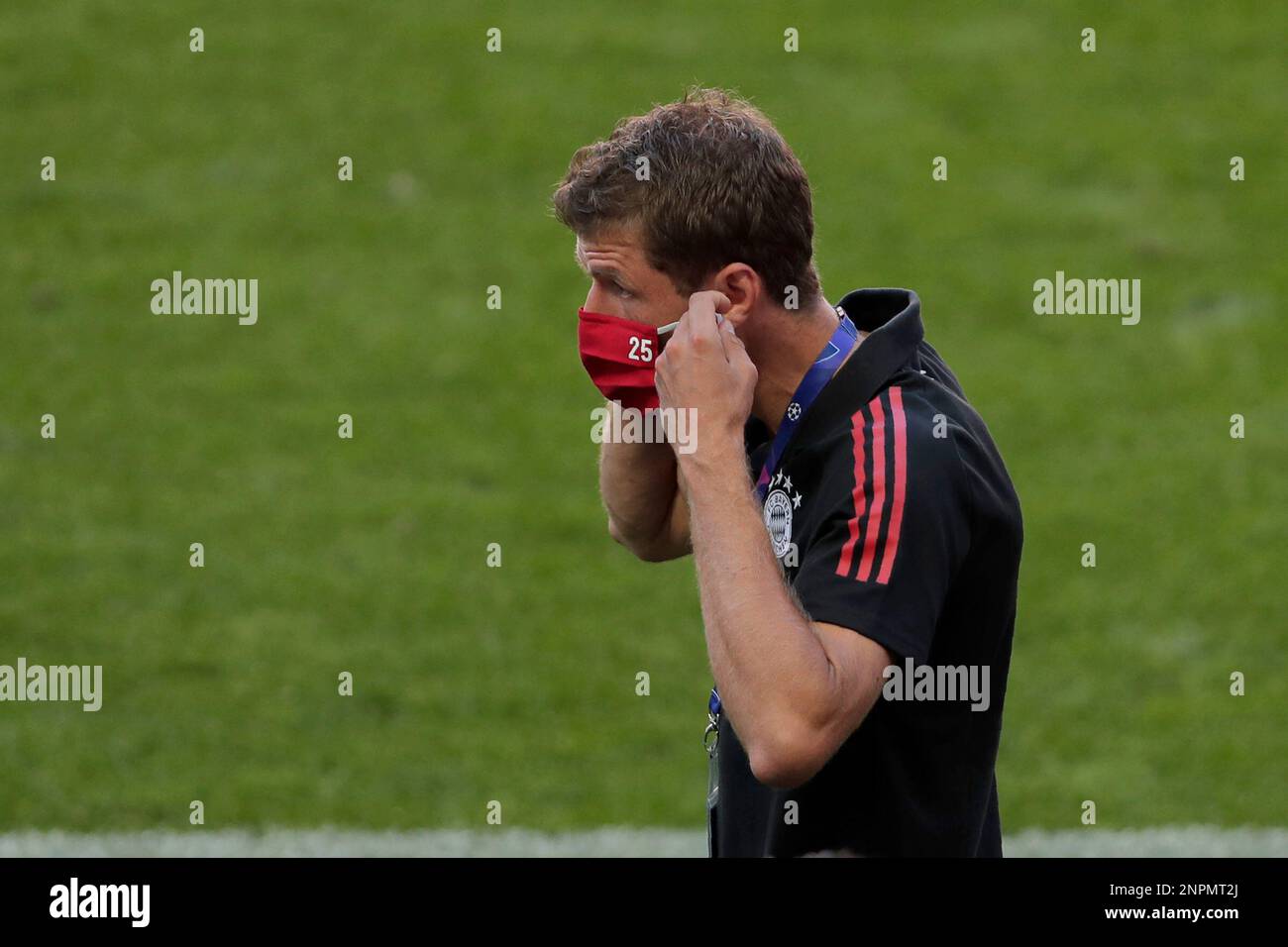 Bayern's Thomas Mueller puts on a face mask before a training session ...