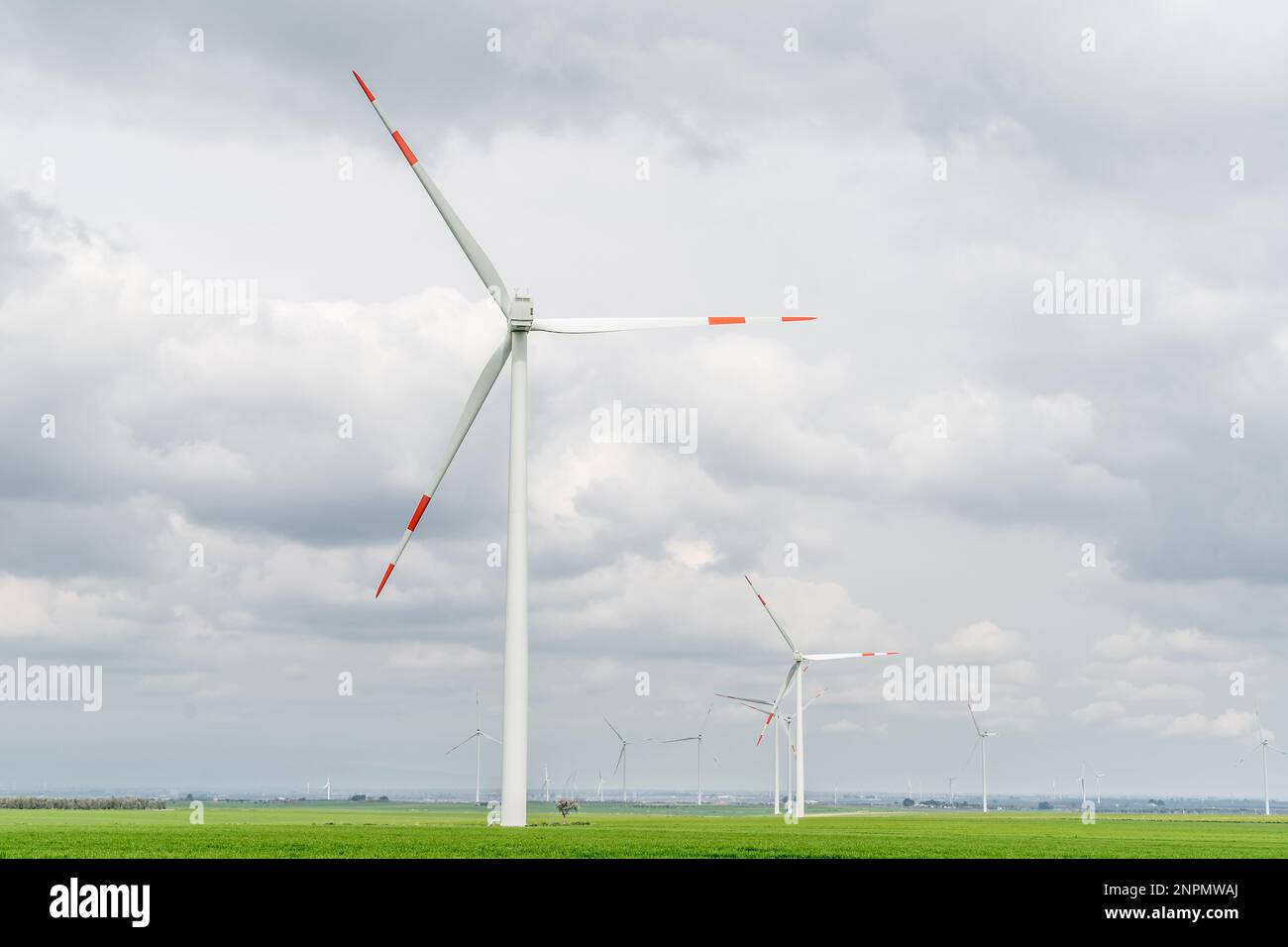 Wind farm in a green field, Wind turbines produce Green Energy Stock ...