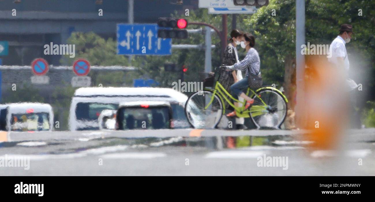 Road mirage is observed in Fukuoka City, on August 11, 2020. The ...
